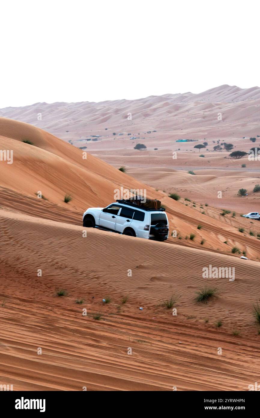 Exploring sandy dunes with off-road vehicles in a desert landscape ...