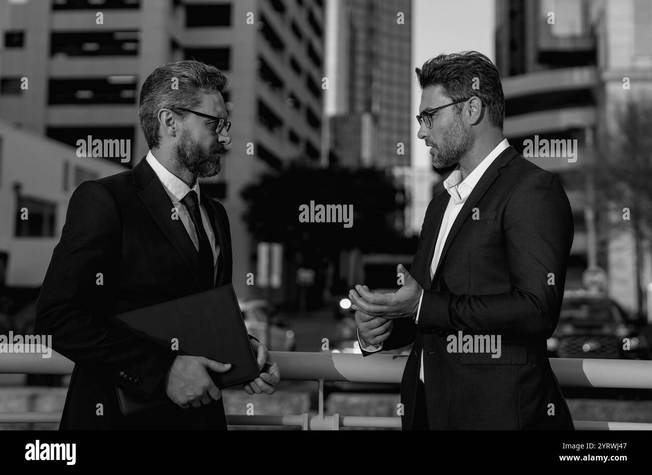 Business partners talking outdoor. Business communication. Two business ...