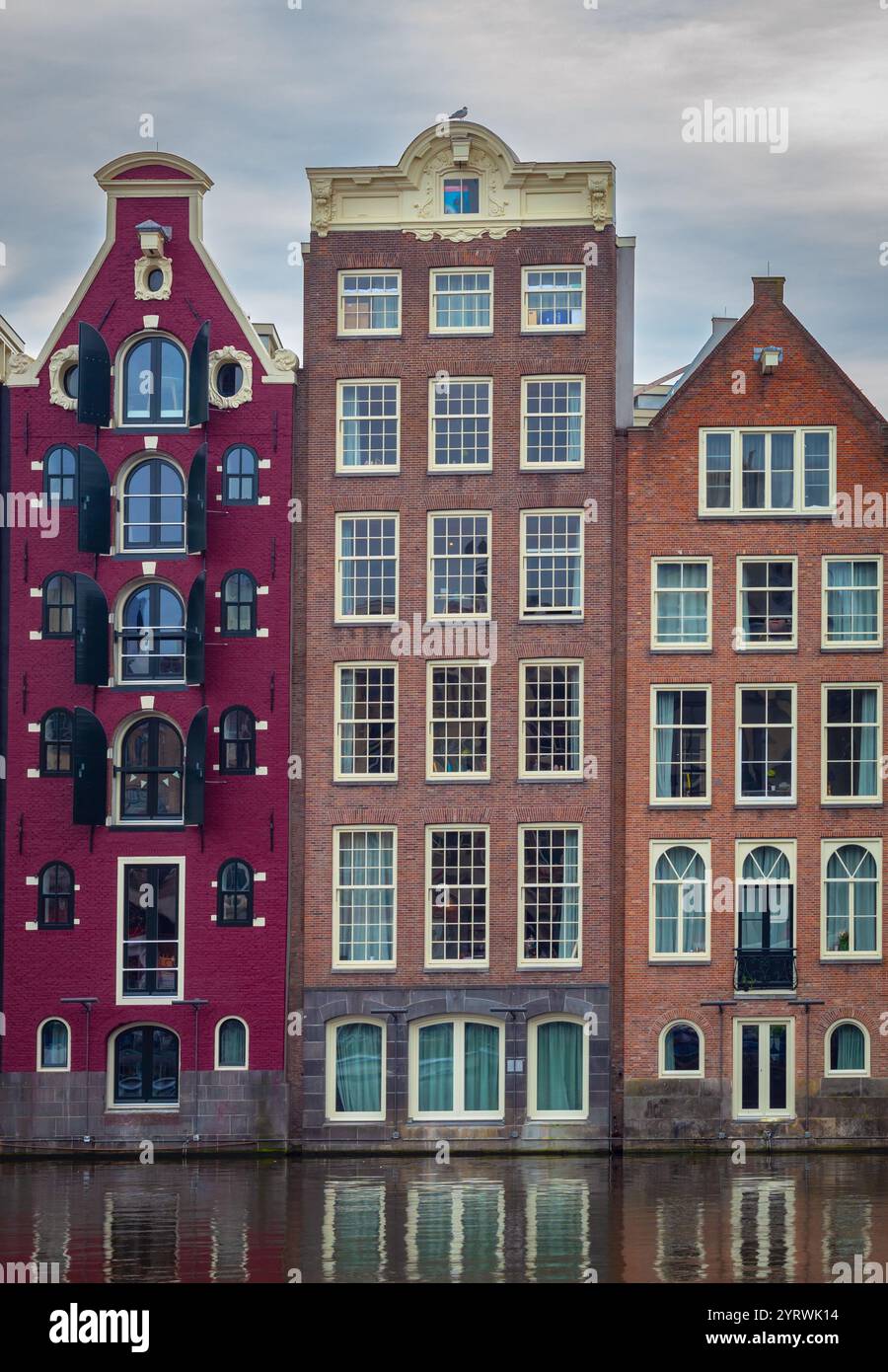 Traditional Dutch architecture buildings lined along the canals in ...