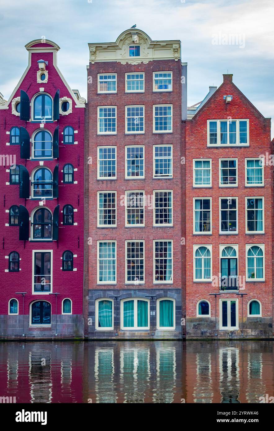 Traditional Dutch architecture buildings lined along the canals in ...