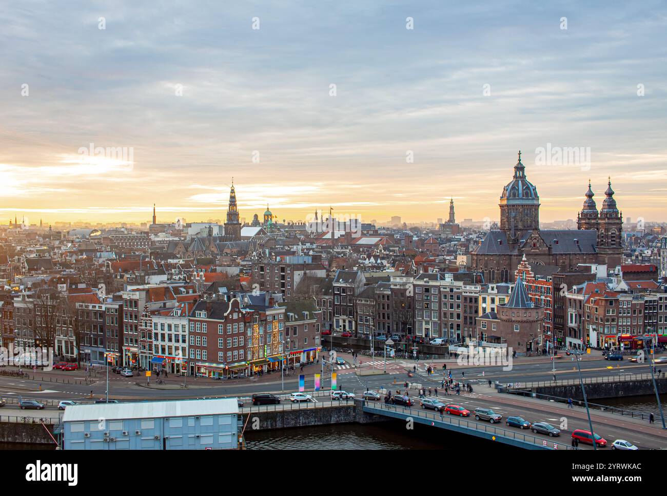 Amsterdam city skyline buildings during a dramatic golden sunset. Photo ...