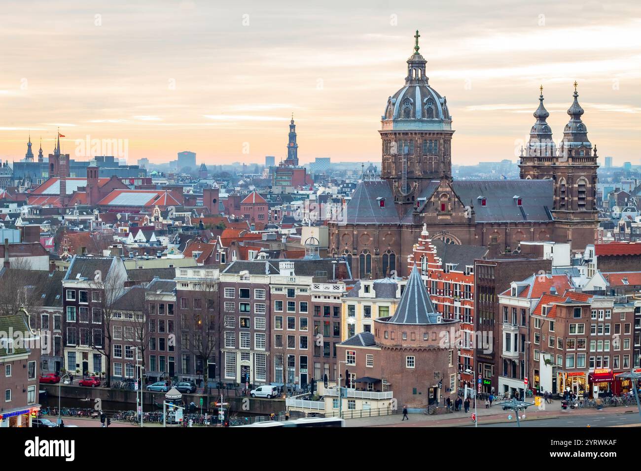 Amsterdam city skyline buildings during a dramatic golden sunset. Photo ...