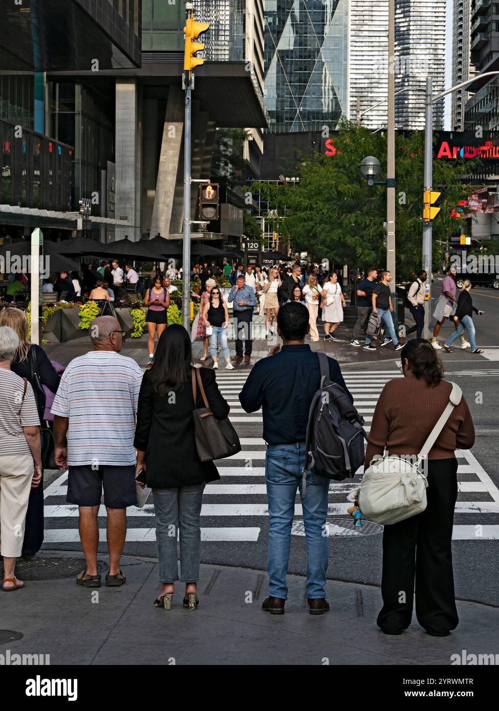 Toronto Canada / Pedestrians walk accross the intersection of Bremner ...