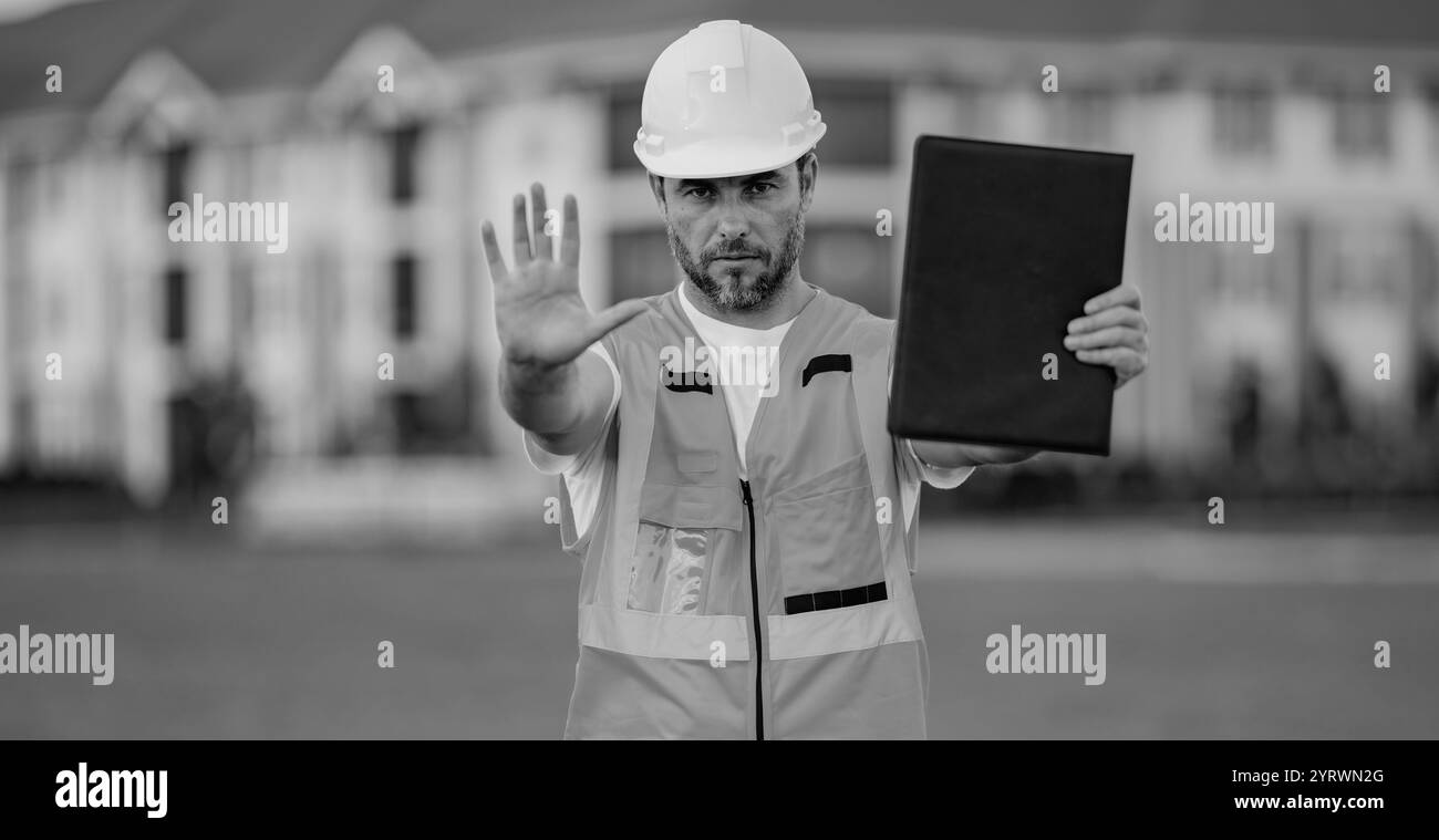 Builder with stop gesture, no hand, dangerous on building concept ...