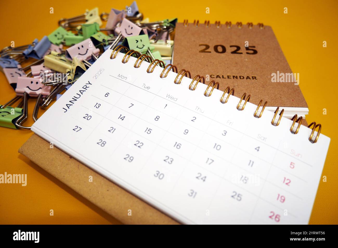 January 2025 desk calendar on a smiling face paper clip Stock Photo - Alamy