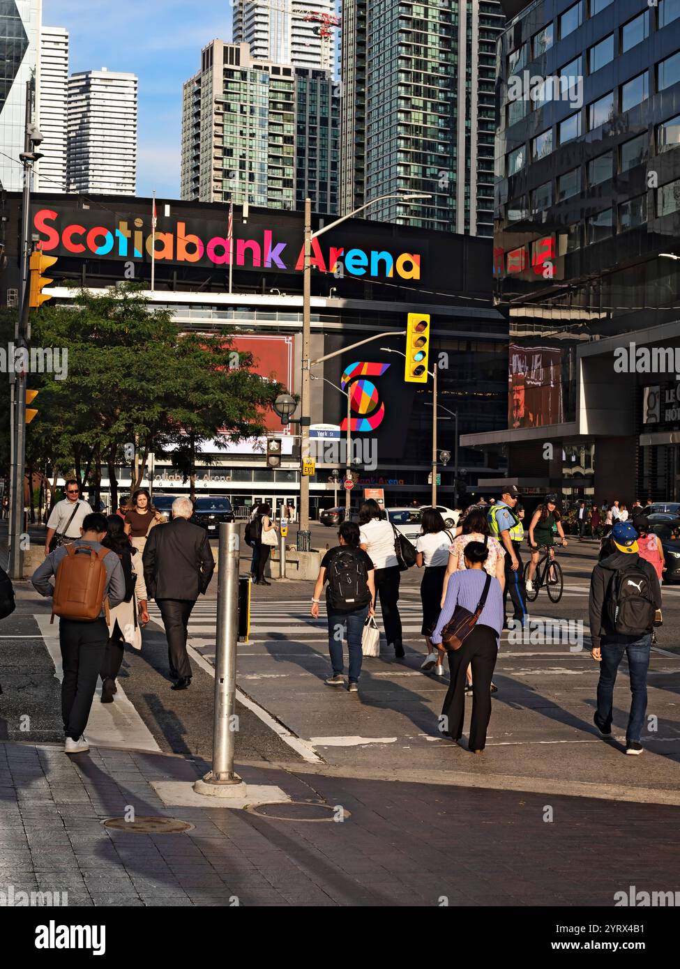 Toronto Canada / Pedestrians walk accross the intersection of Bremner ...
