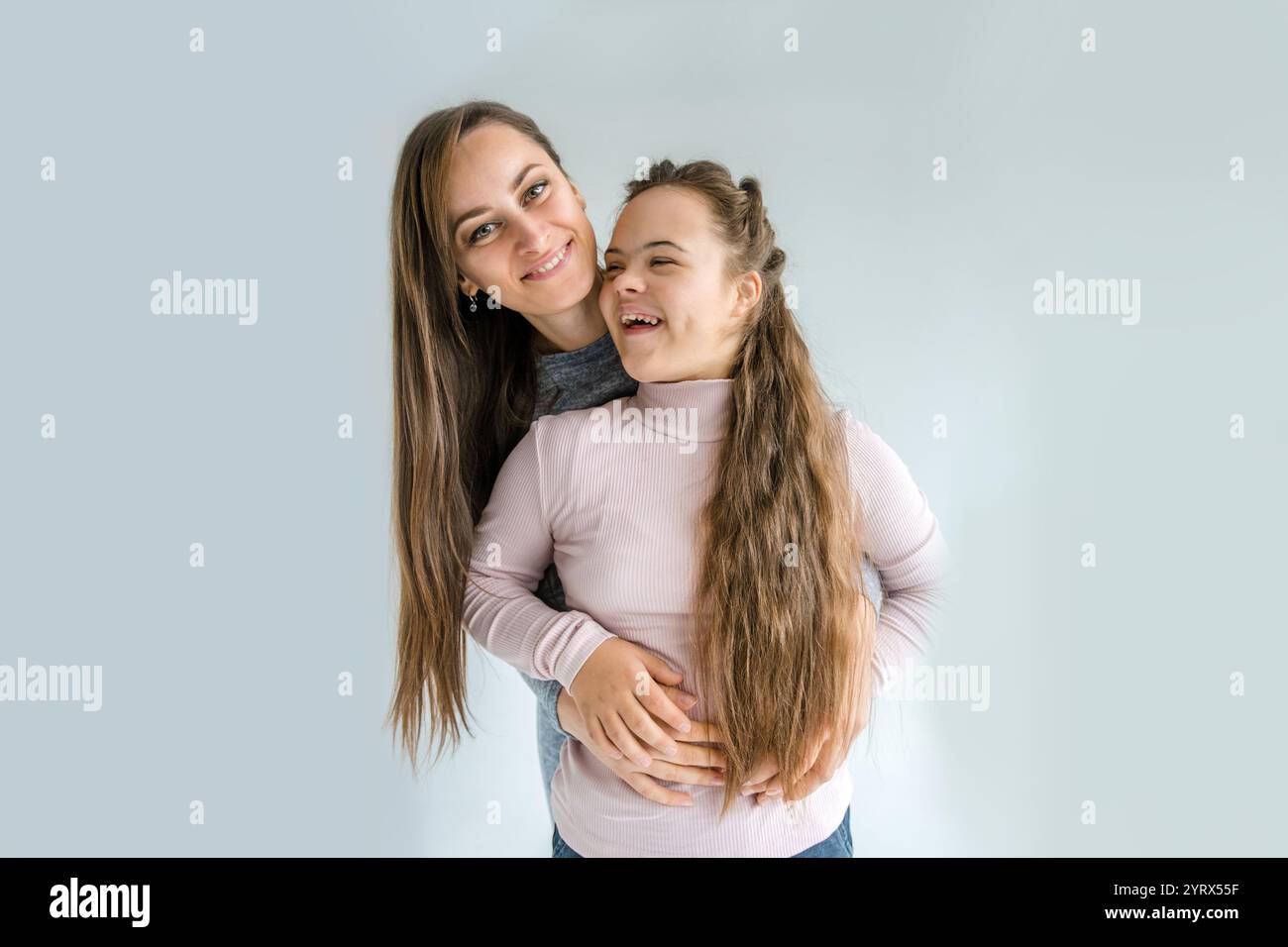 A heartwarming image of a mother and daughter with Down syndrome ...
