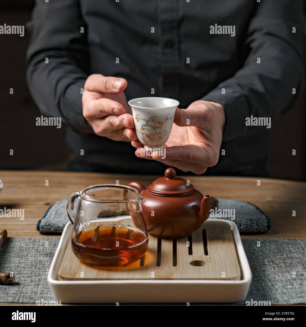 An Elegant Tea Ceremony featuring a Traditional Tea Set alongside ...