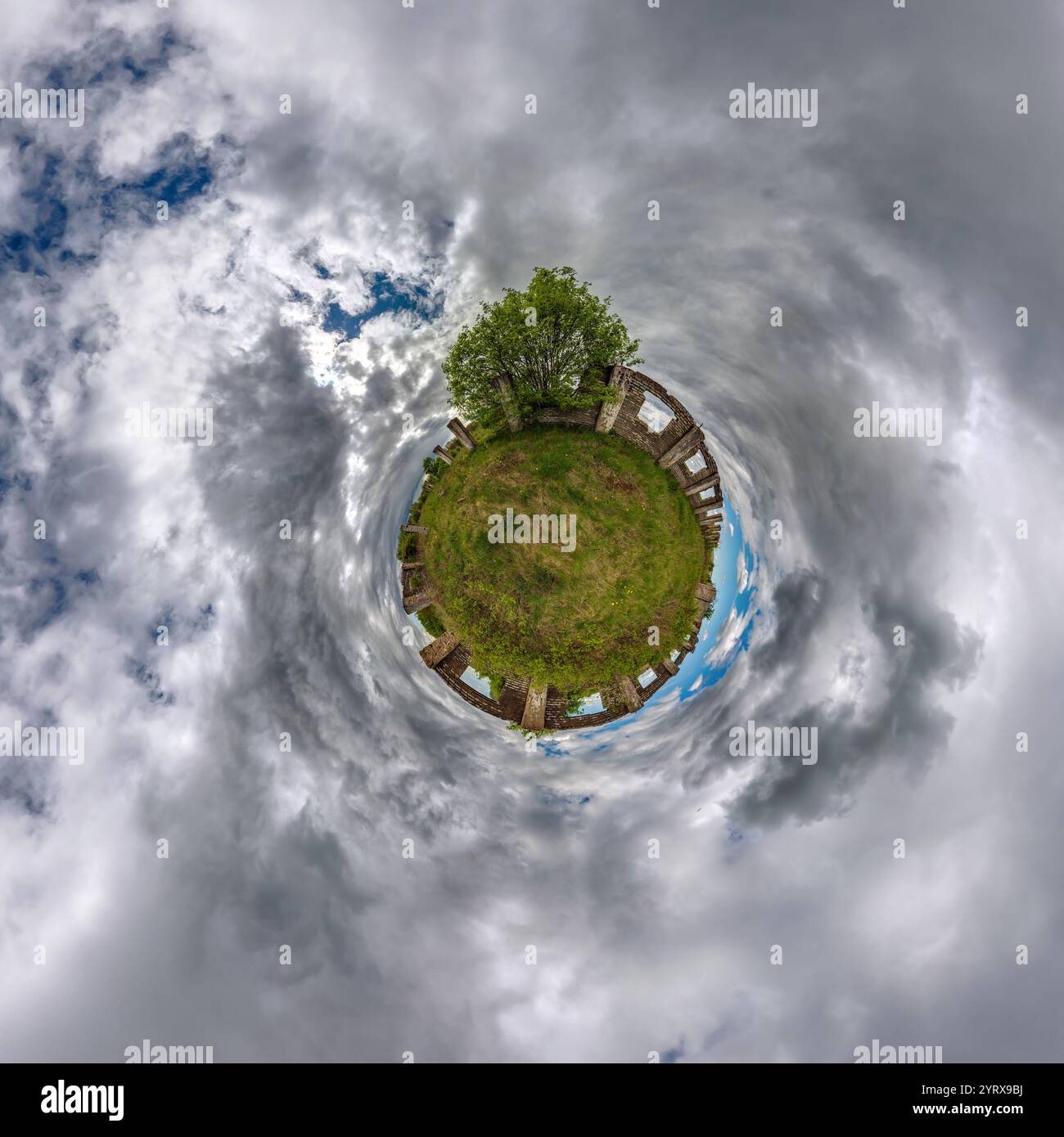 tiny planet in blue sky with clouds of old abandoned ruined church ...