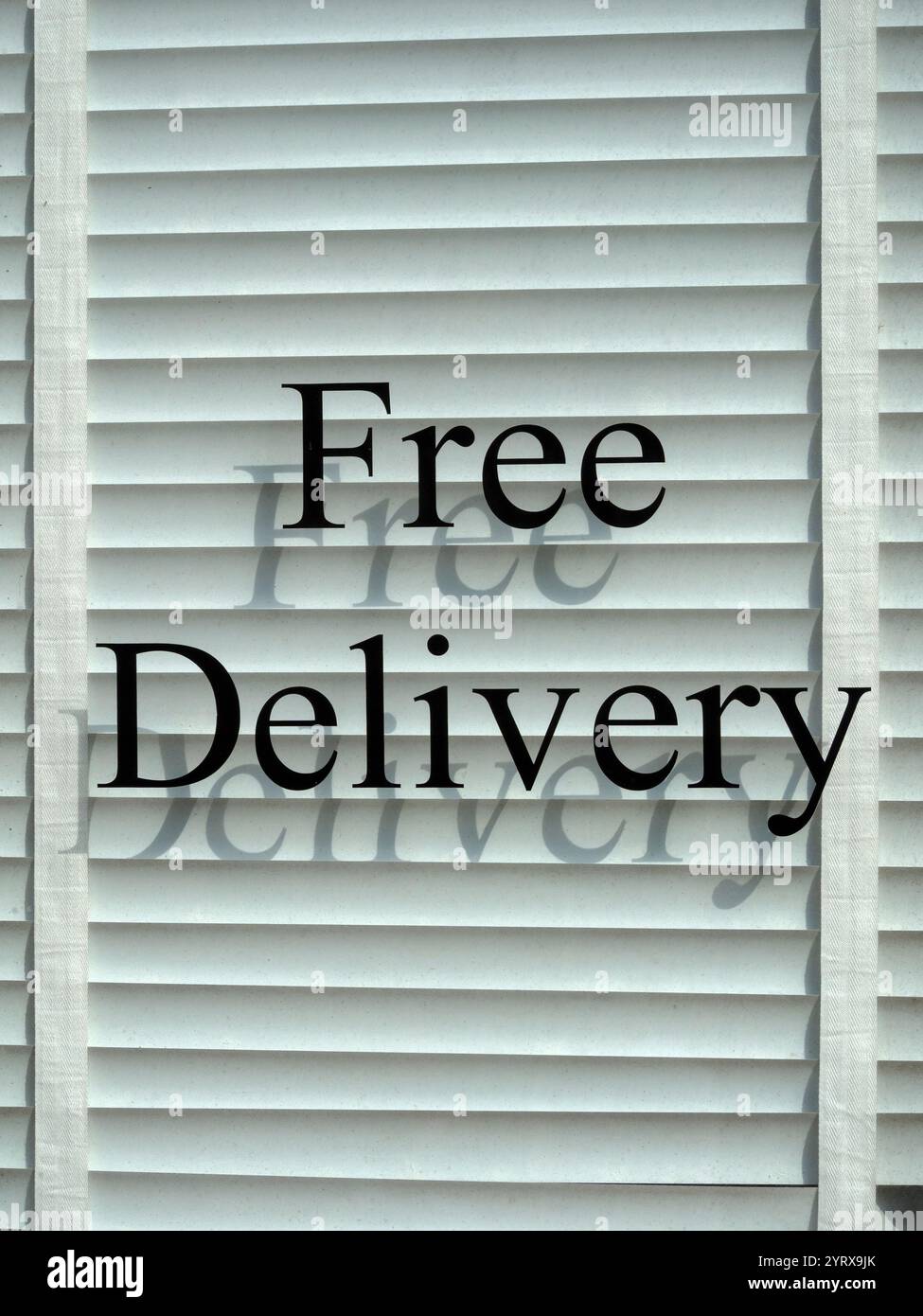 Sign for Free Delivery on a takeaway restaurant window with blinds ...
