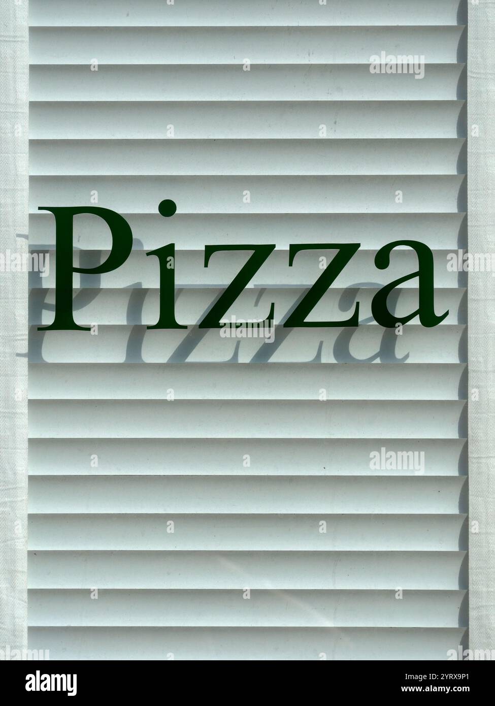 Sign for Pizza on a takeaway restaurant window with blinds Stock Photo ...