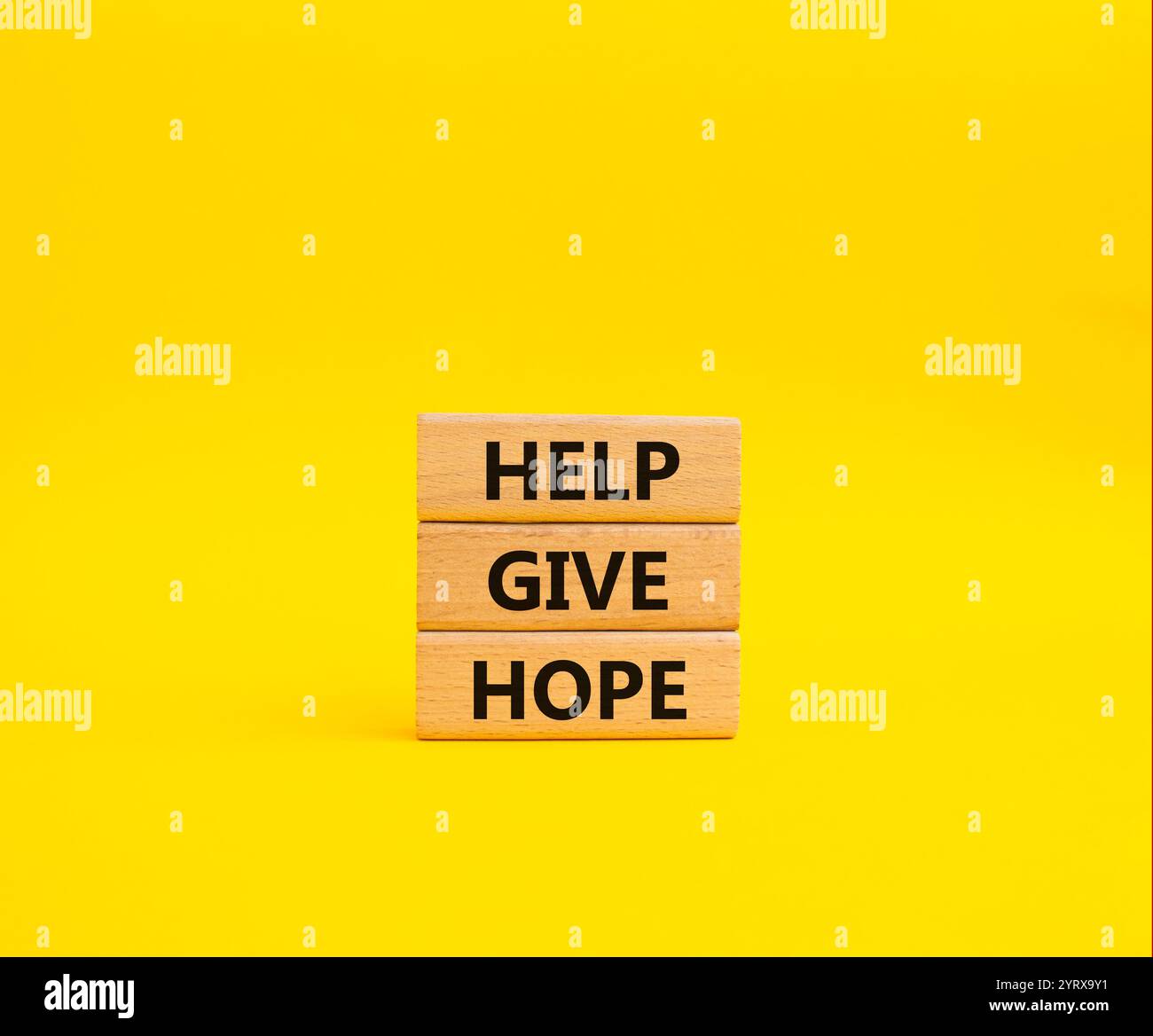 Help Give Hope symbol. Concept words Help Give Hope on wooden blocks ...