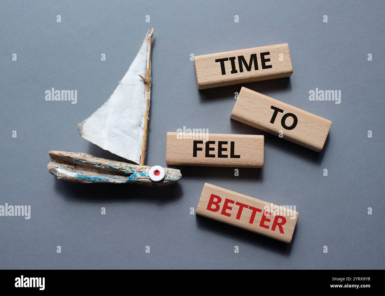 Time to feel better symbol. Wooden blocks with words Time to feel ...