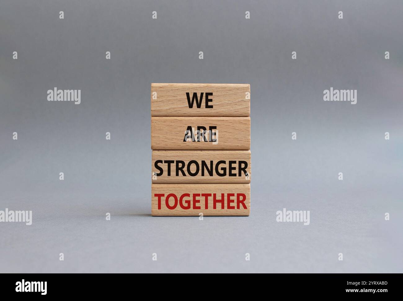 We are stronger together symbol. Wooden blocks with words We are ...
