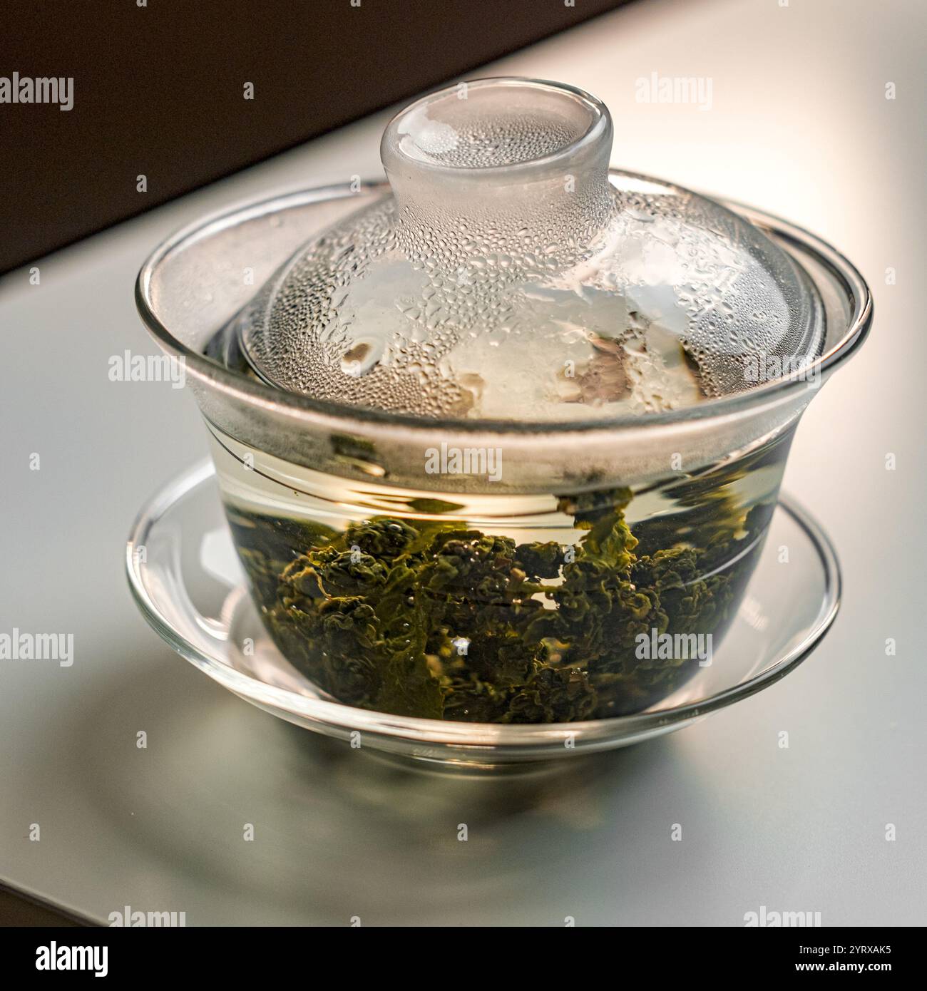 Enjoy the delightful steaming green tea infusion crafted in an elegant ...