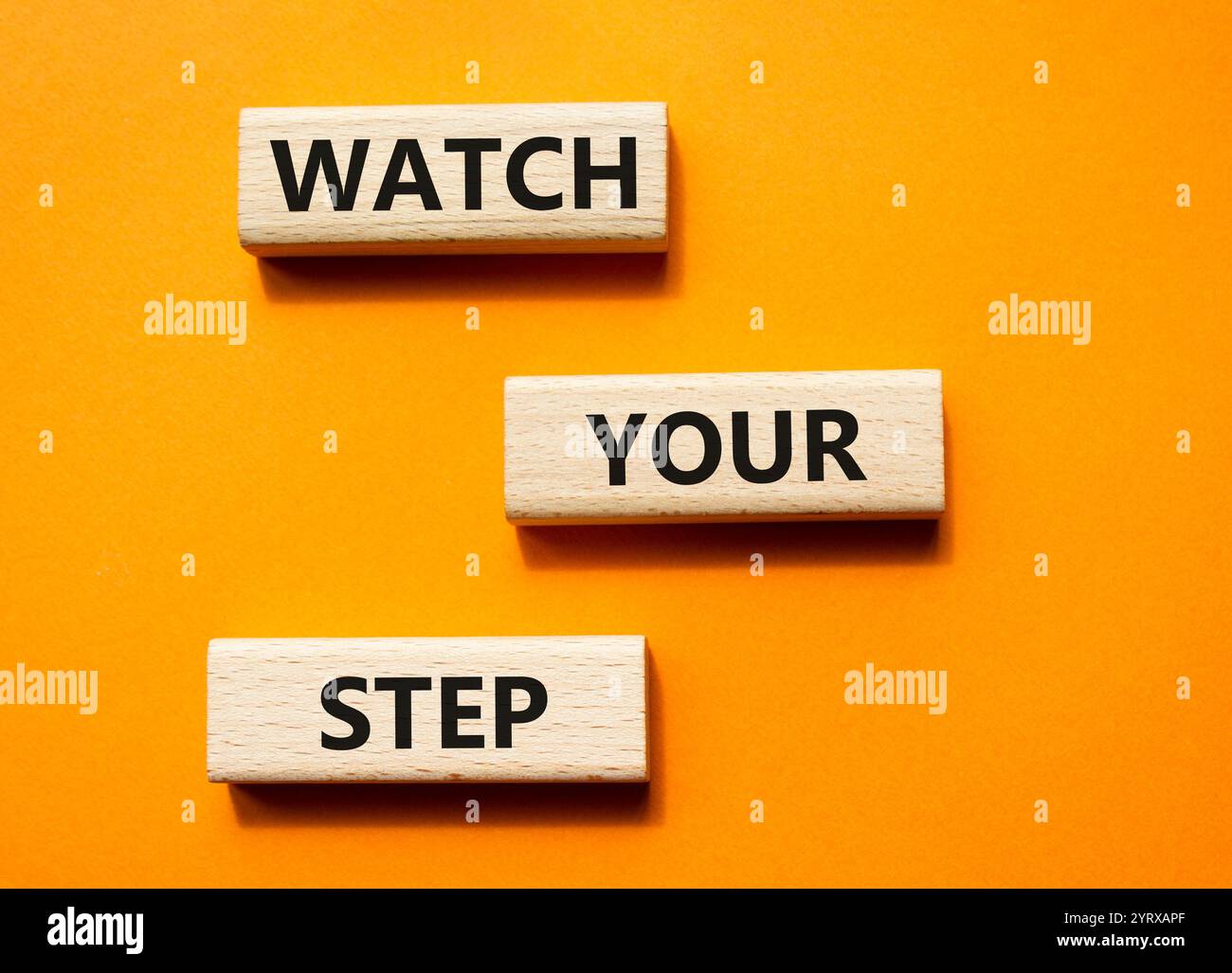 Watch your Step symbol. Concept words Watch your Step on wooden blocks ...