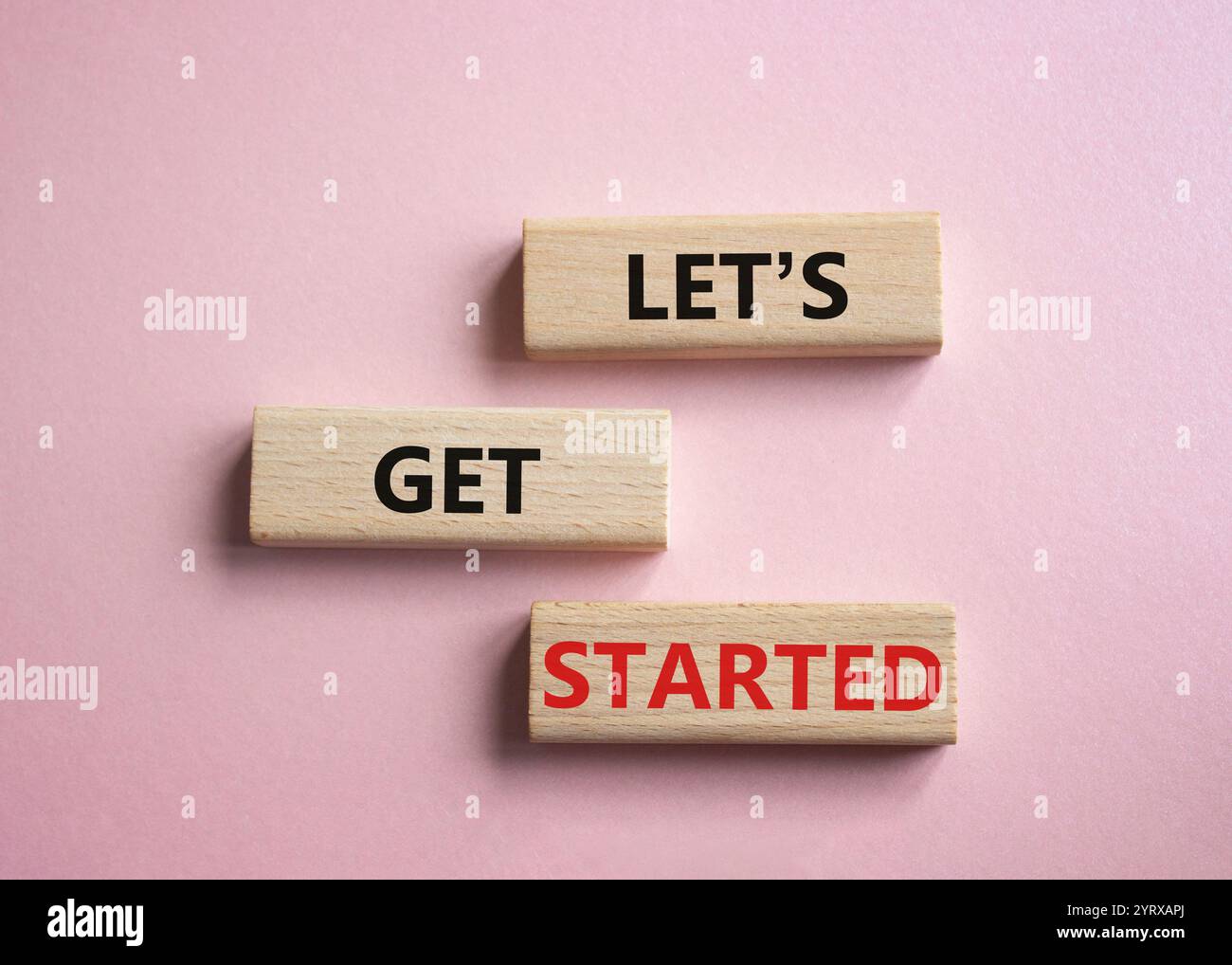 Lets get started symbol. Concept words Lets get started on wooden ...