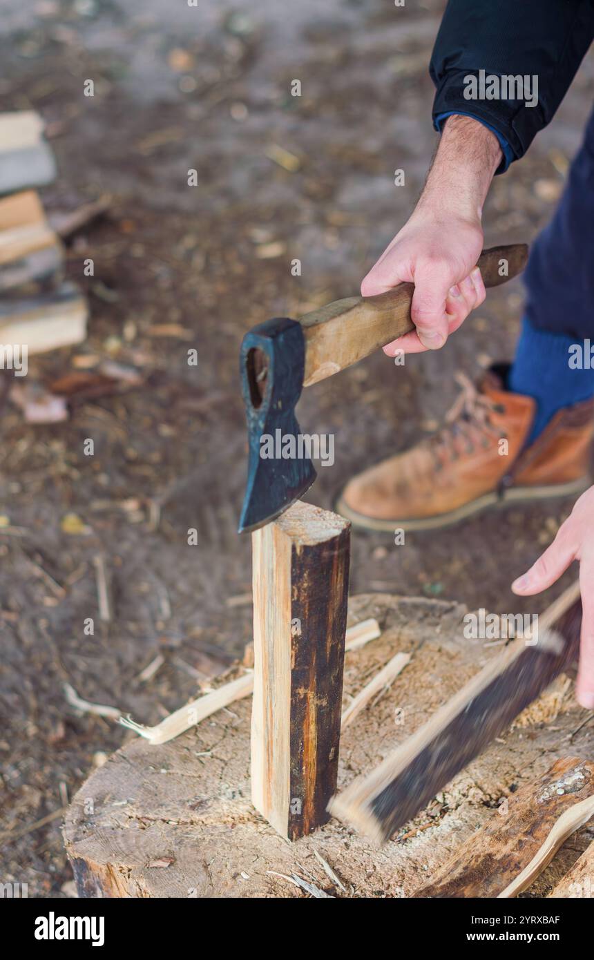 Man`s hand chopping firewood tree hi-res stock photography and images ...