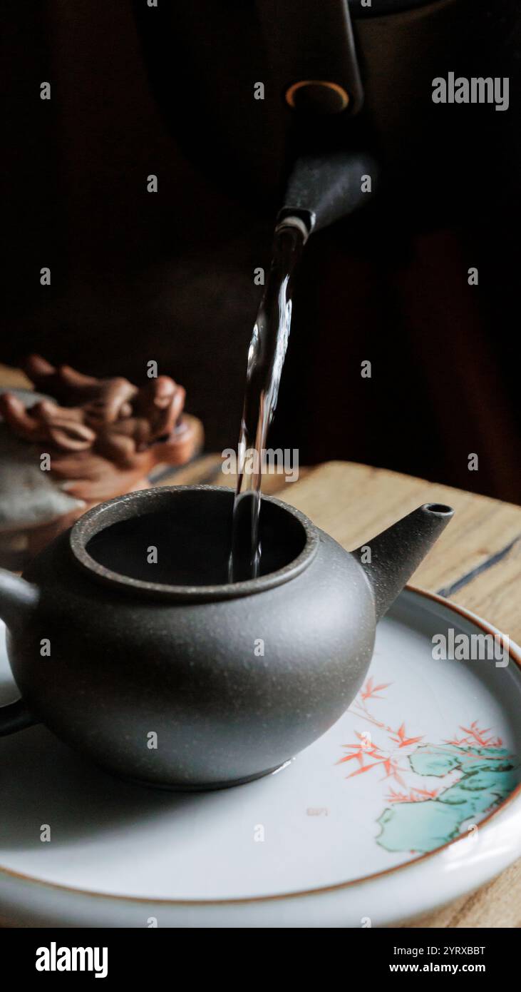 The Elegant and Artful Tea Pouring from a Traditional Teapot Creates a ...