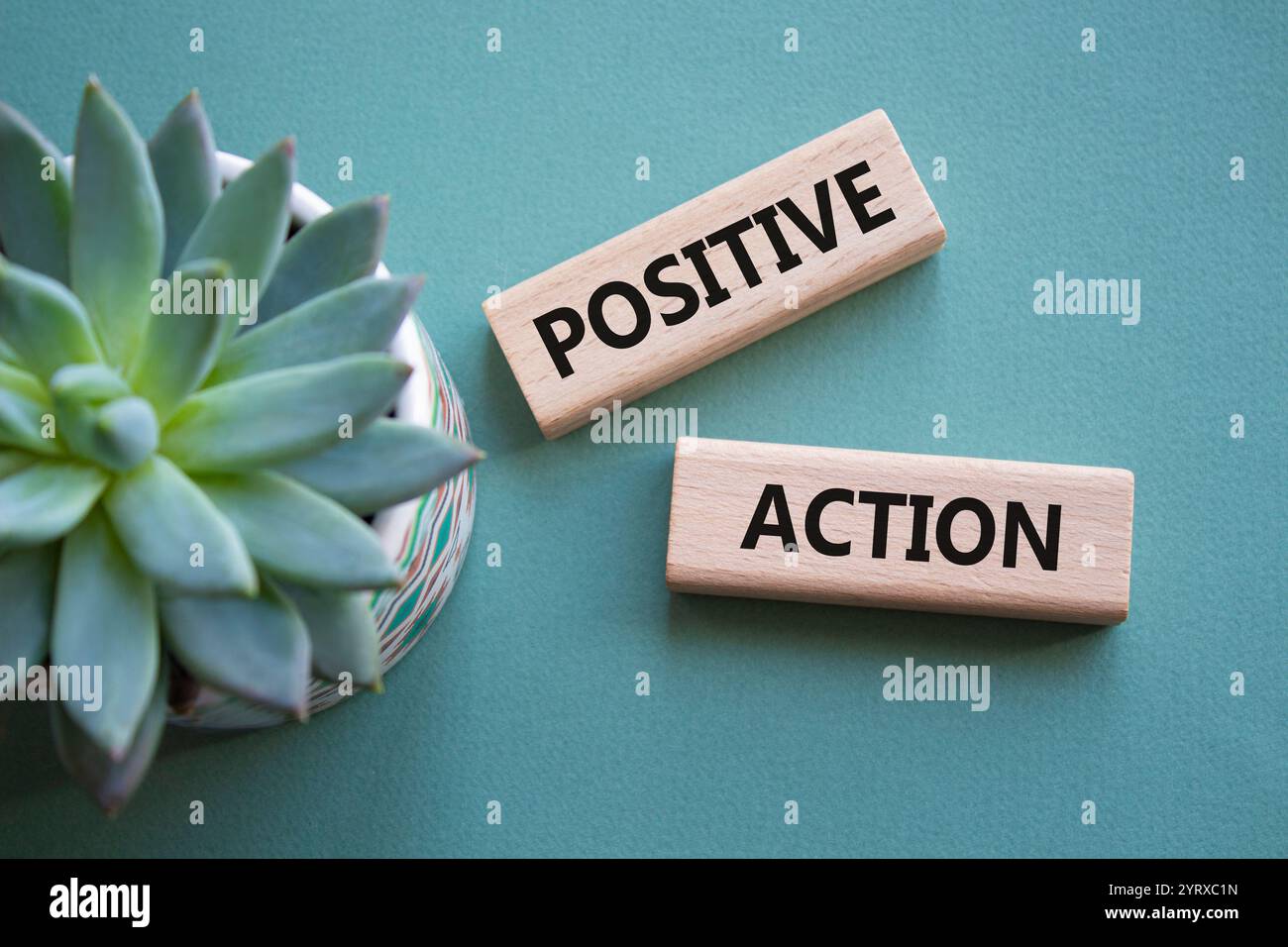 Positive action symbol. Concept words Positive action on wooden blocks ...