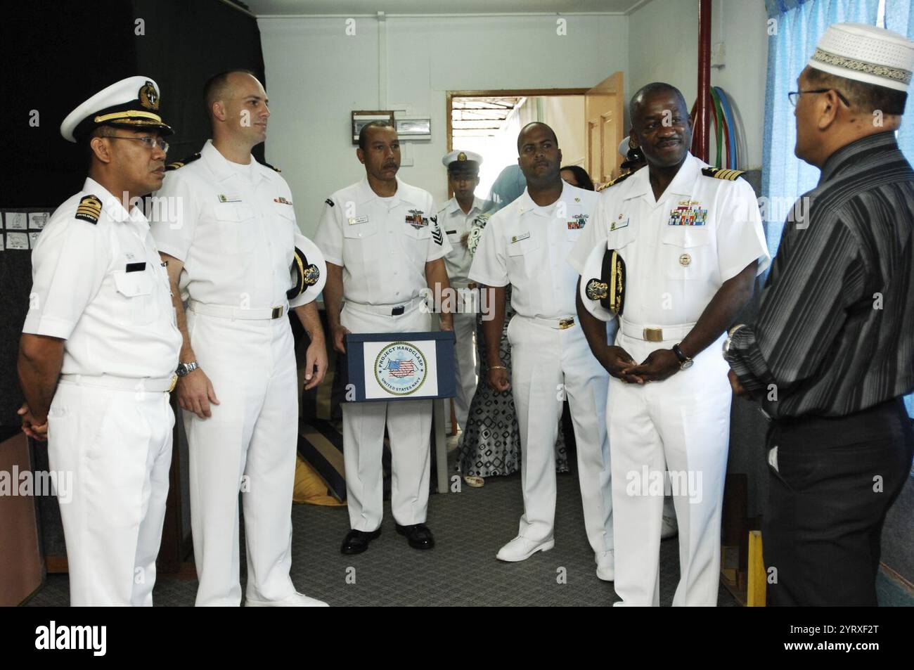 Commodore Richard Clemmons, Jr., second from right, commander ...