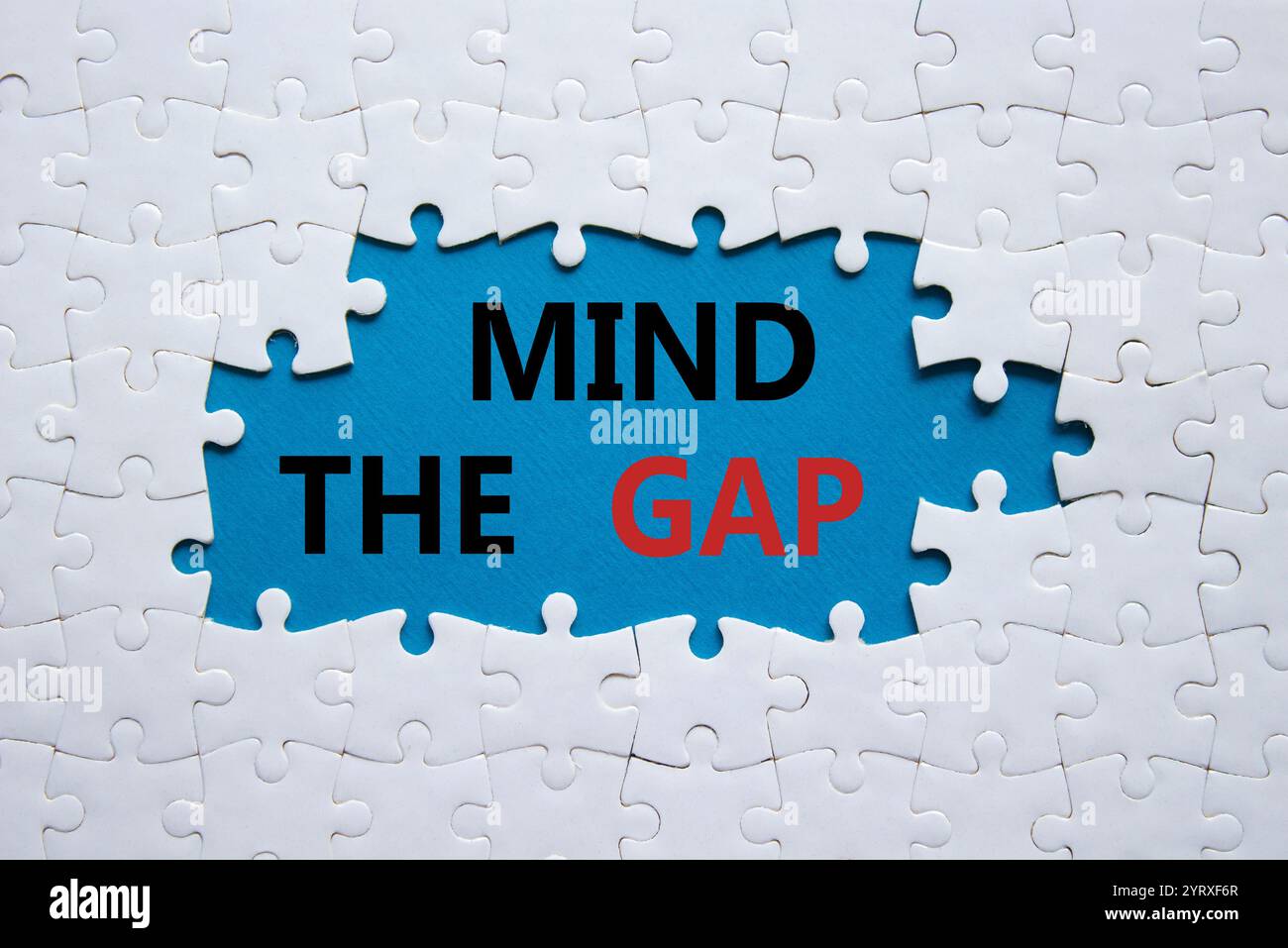 Mind the gap symbol. Concept words Mind the gap on white puzzle ...