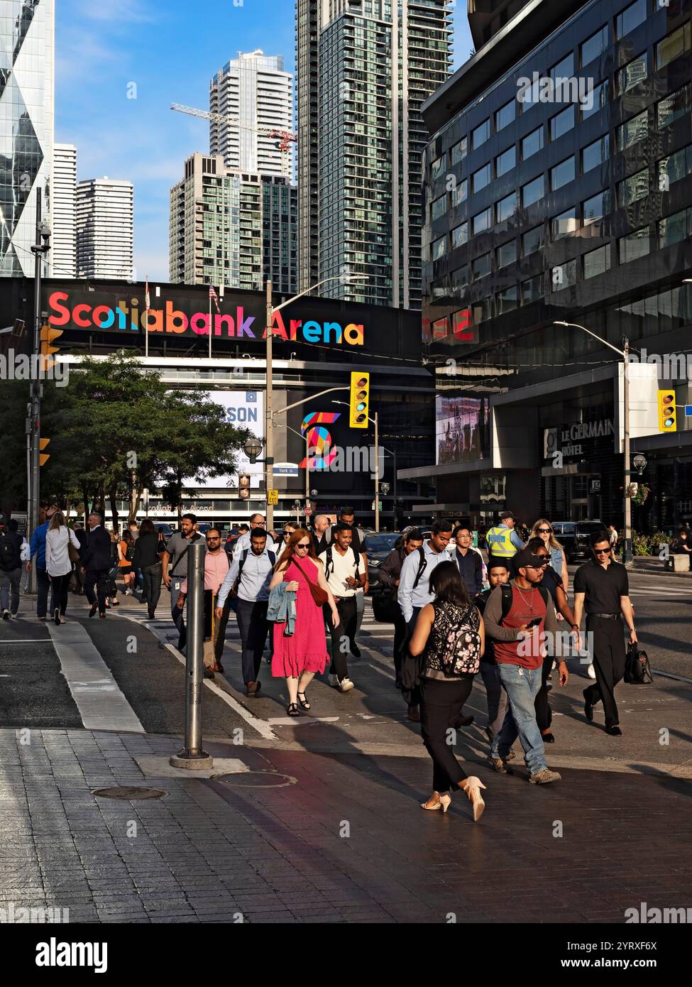 Toronto Canada / Pedestrians walk accross the intersection of Bremner ...
