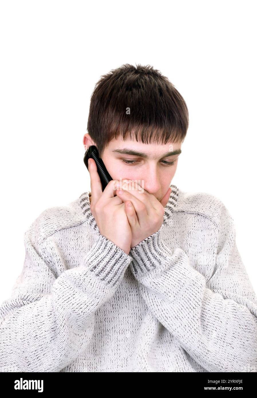 young man secretly talking on mobile phone on the white background ...