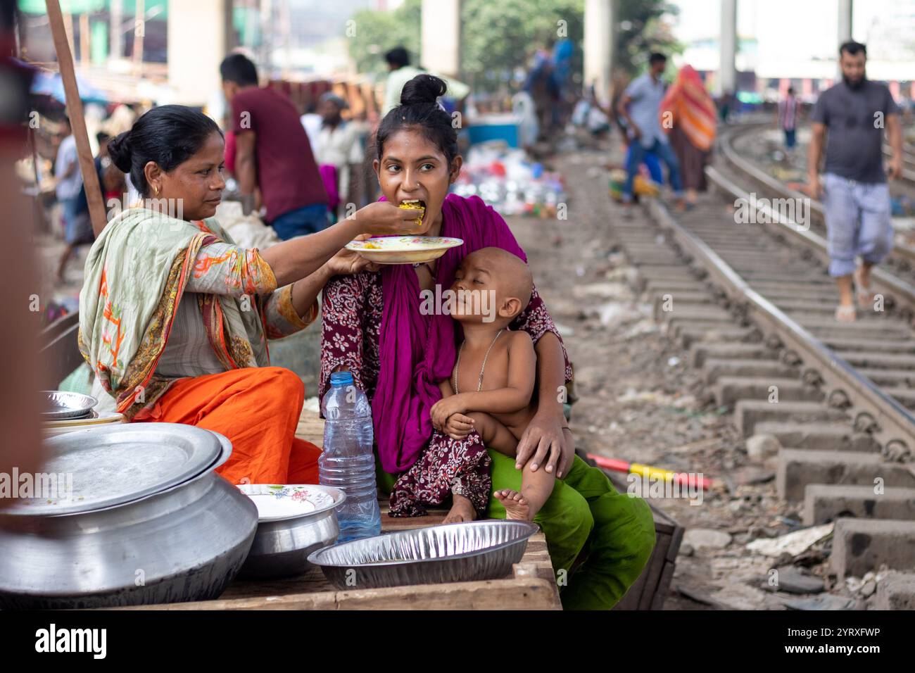 December 5, 2024, Dhaka, Dhaka, Bangladesh: Life along the railway tracks in Dhaka's Kawran ...