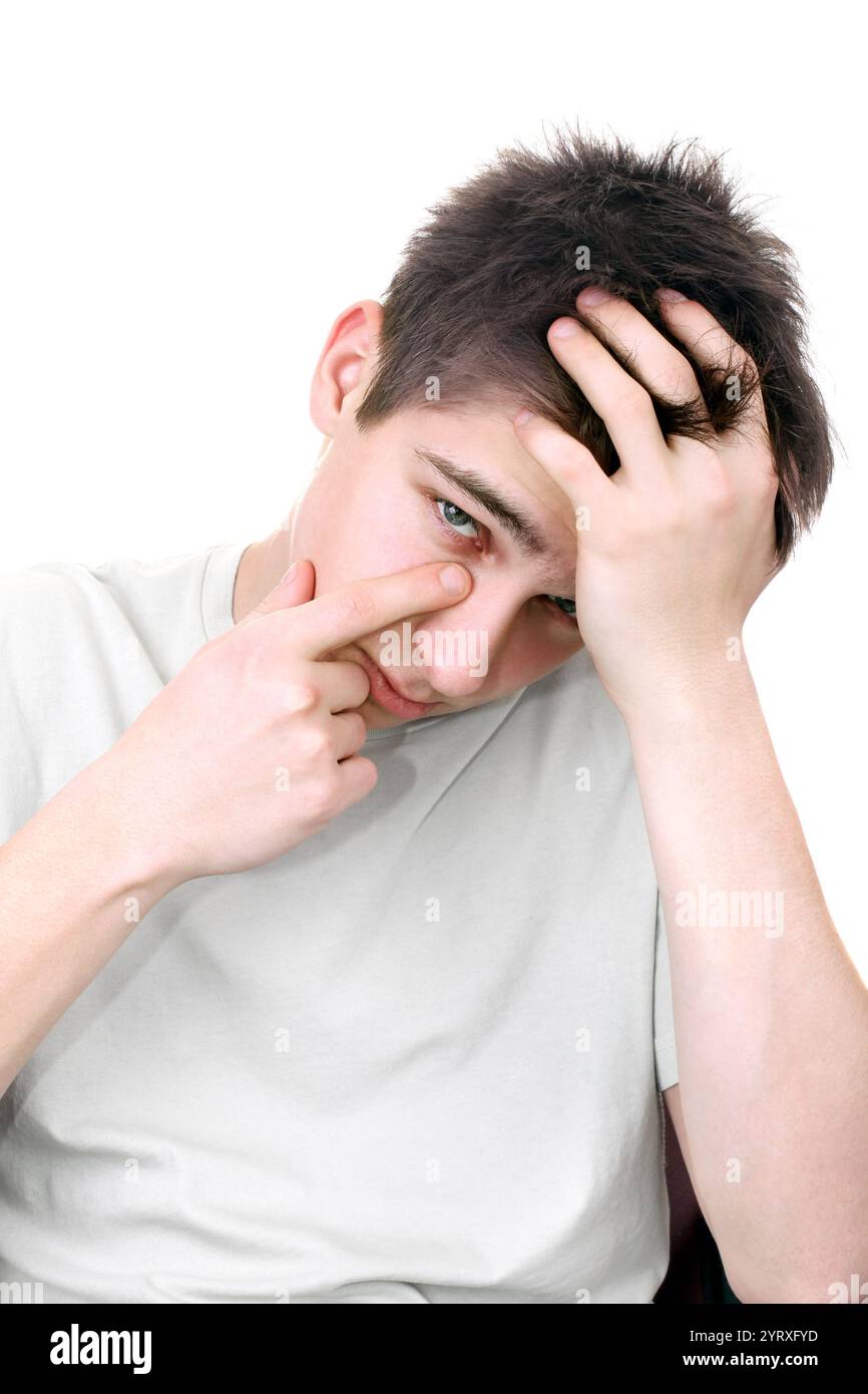 sad young man wipe tears isolated on the white background Stock Photo ...