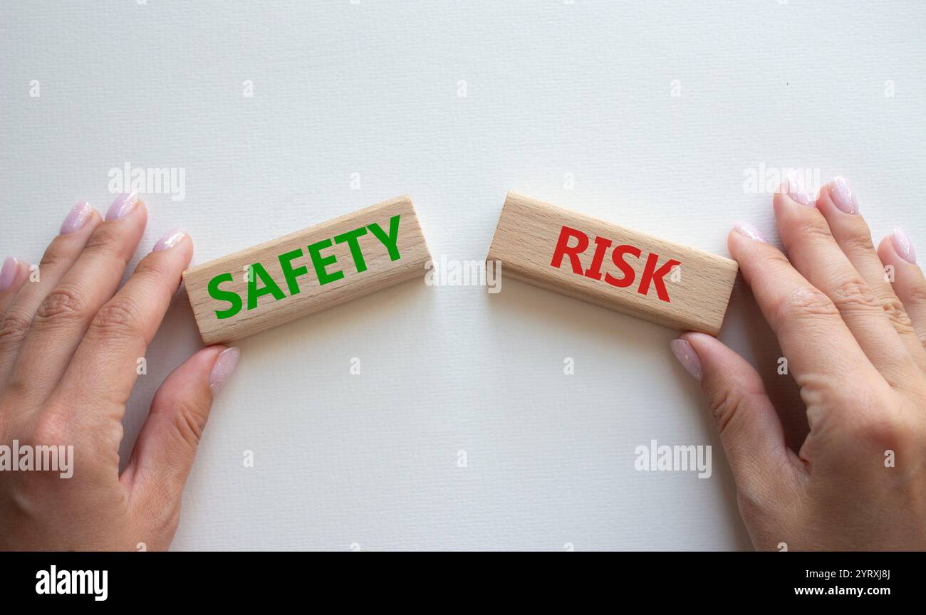 Safety or Risk symbol. Concept word Safety or Risk on wooden blocks ...