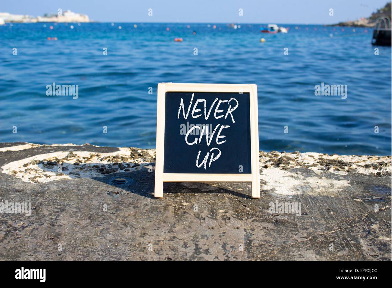 Never give up symbol. Blackboard with Concept words Never give up ...