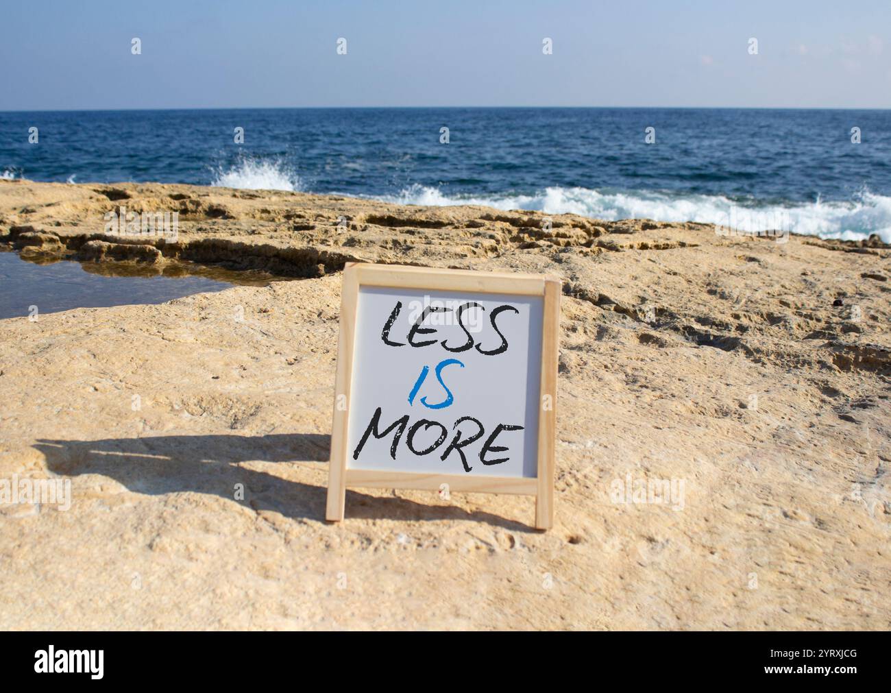 Less is More symbol. White Blackboard with Concept words Less is More ...
