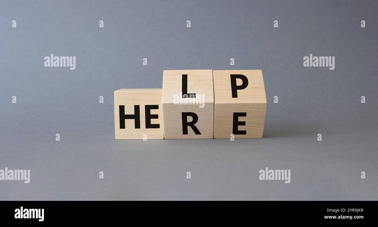 Help is here symbol. Turned wooden cubes with words Here to Help ...