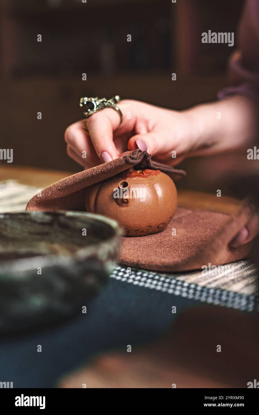 An artisan is carefully crafting a unique and beautiful pottery piece ... An artisan is carefully crafting a unique and beautiful pottery piece ...