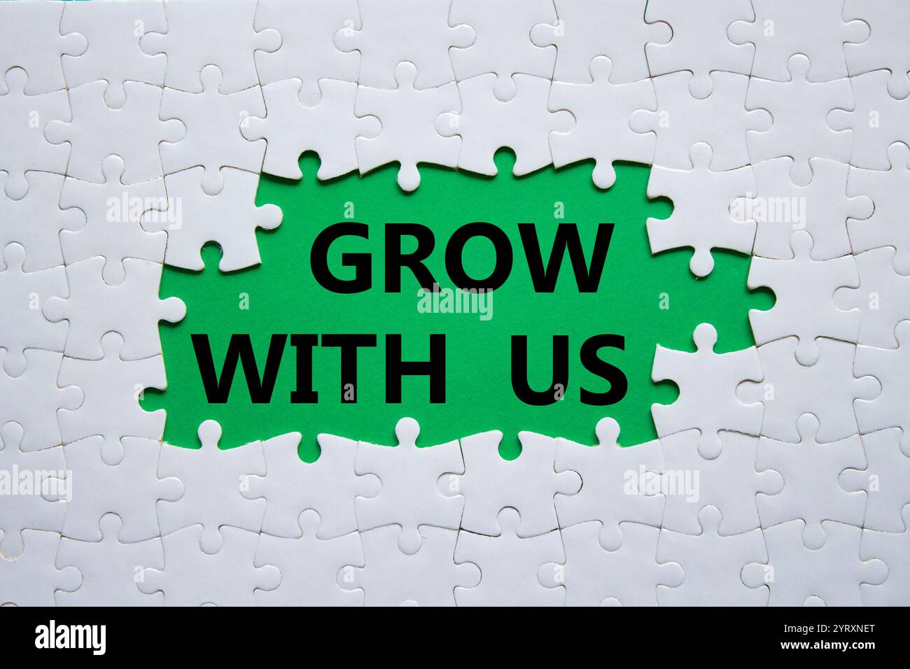 Grow with us symbol. Concept words Grow with us on white puzzle ...