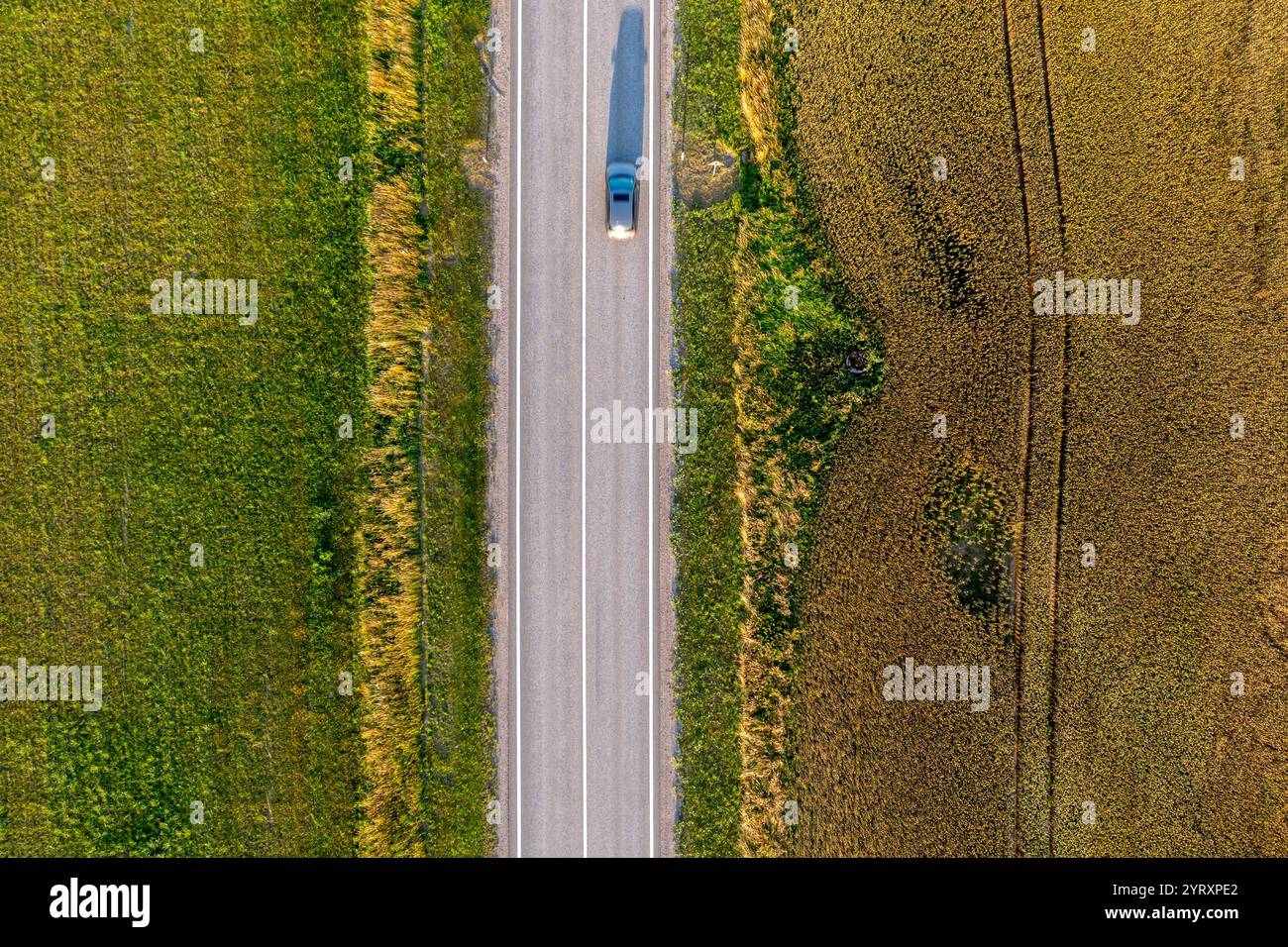 Cars drive along country road hi-res stock photography and images - Alamy