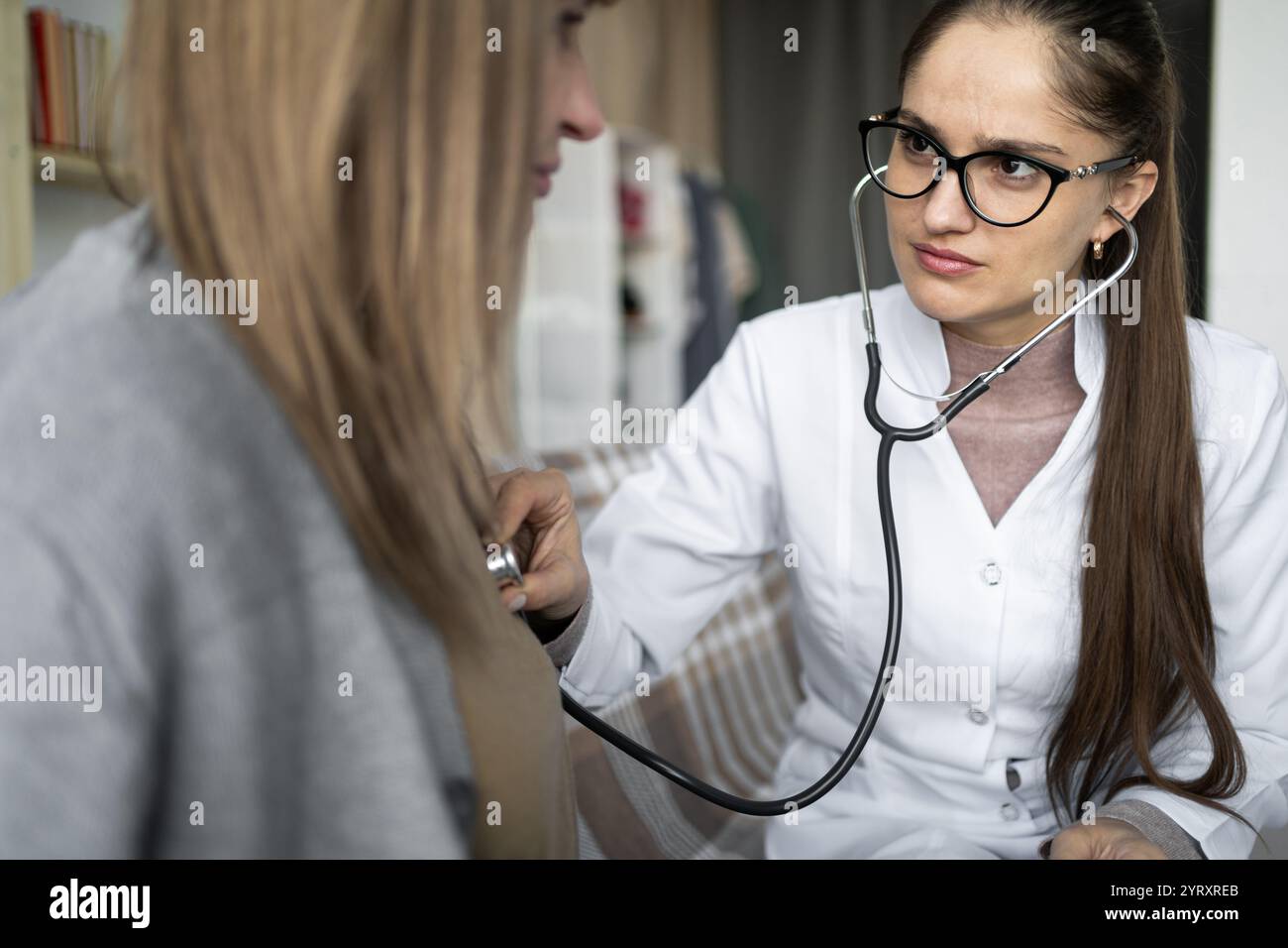 heart and lungs checkup. Female doctor using stethoscope listening to ...