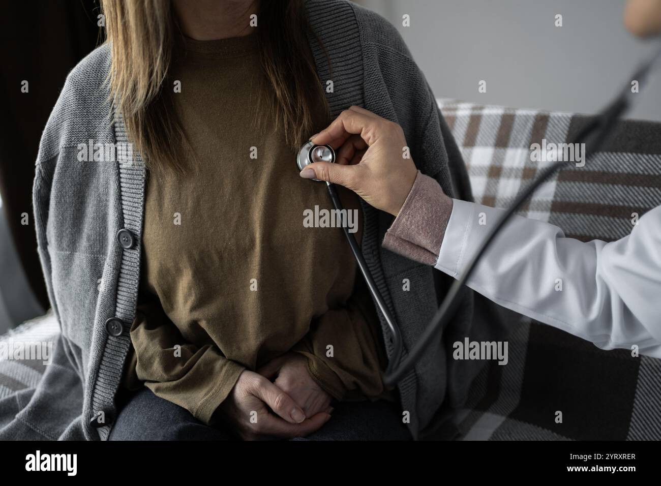heart and lungs checkup, female doctor using stethoscope while ...