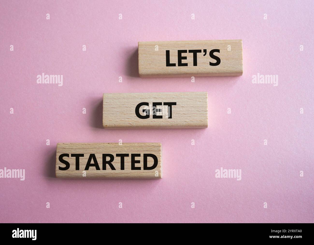 Lets get started symbol. Concept words Lets get started on wooden ...