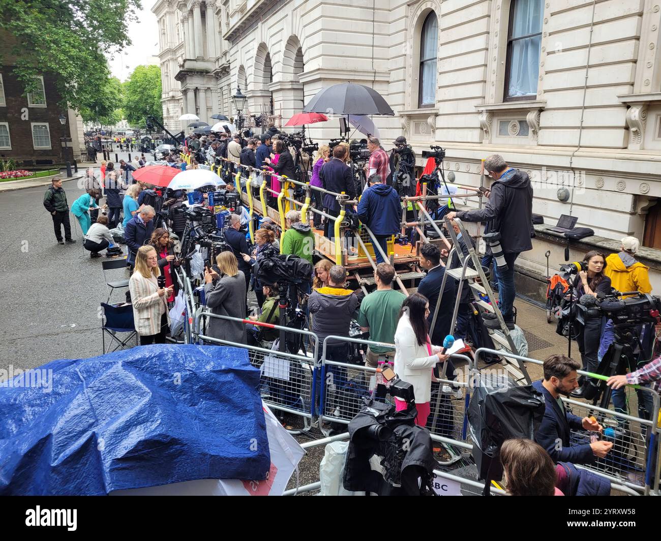 International press gathered in downing Street, London to report on the ...