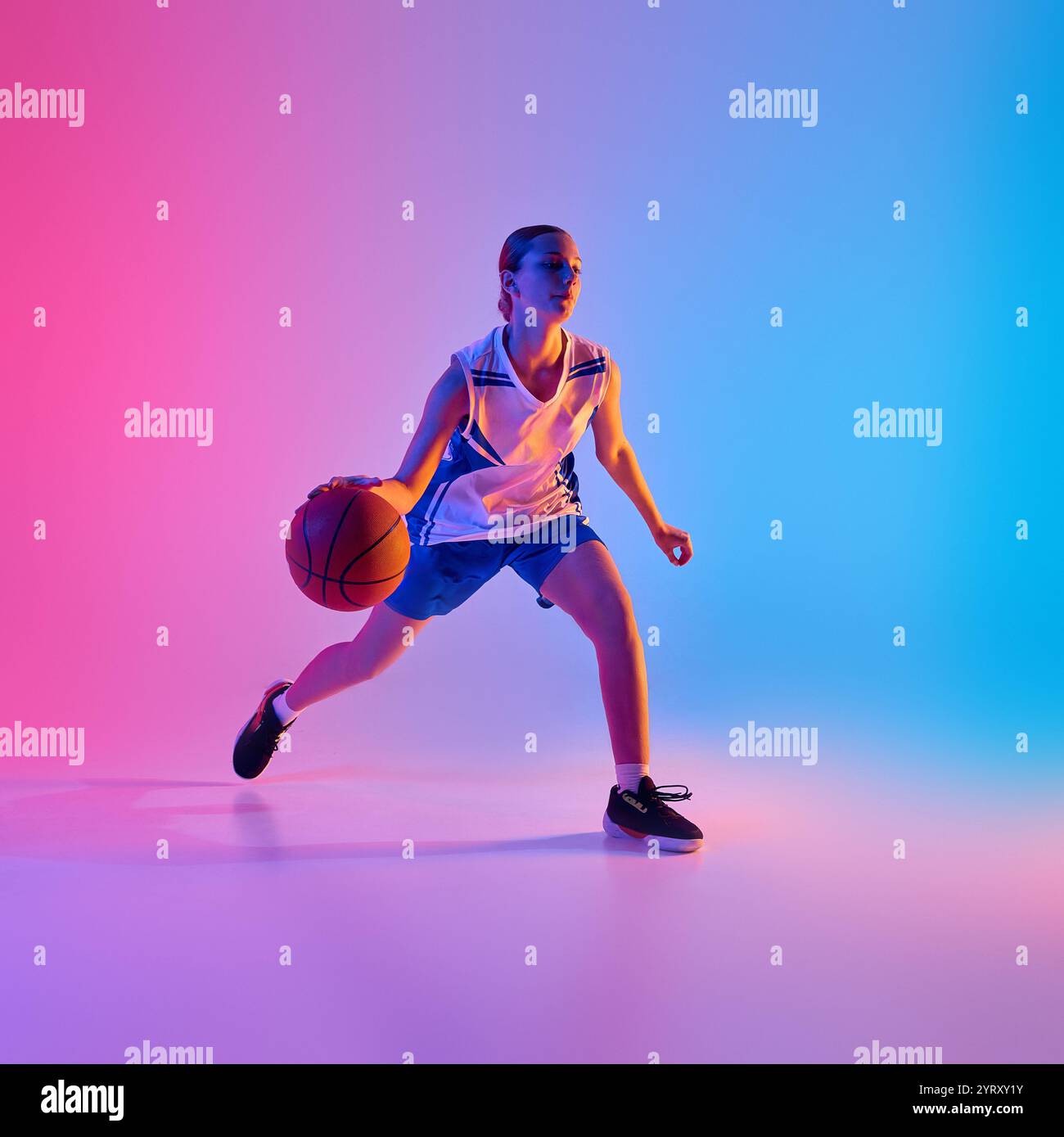 Dynamic image of young teen girl, basketball player in motion with ball ...