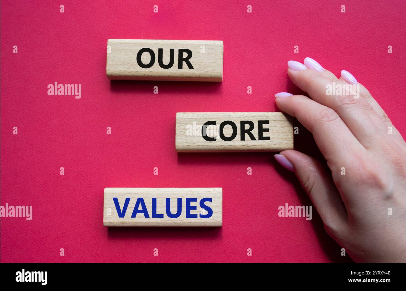 Our core values symbol. Concept words Our core values on wooden blocks. Beautiful red background ...