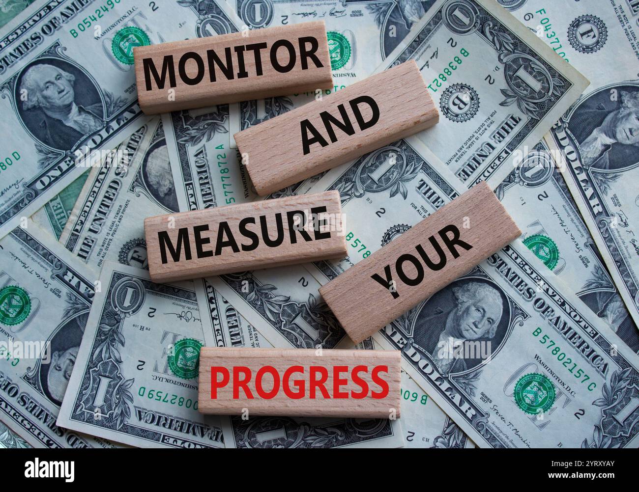 Monitor and Measure your Progress symbol. Wooden blocks with words ...