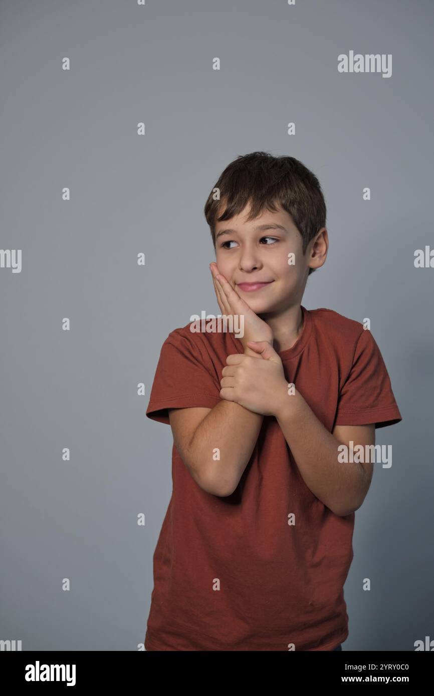 Peaceful child with a subtle smile, suggesting contentment in ...