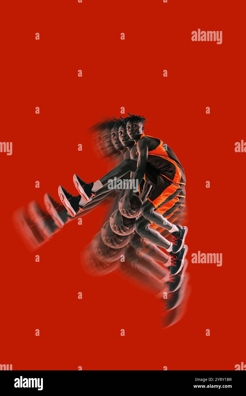 Basketball player mid-air holding ball, bold red background ...