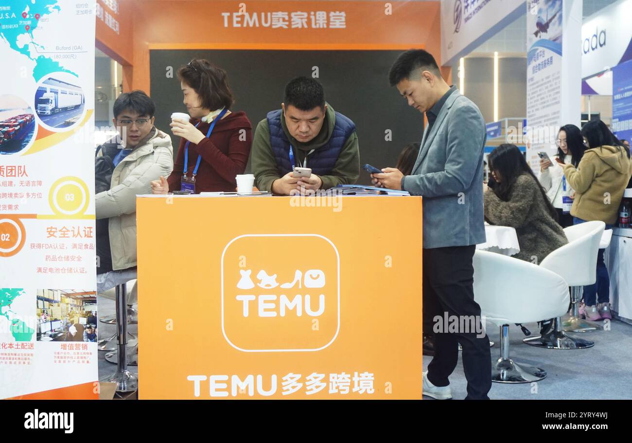 Visitors visit the stand of Pinduoduo's Temu at a fashion exhibition in ...