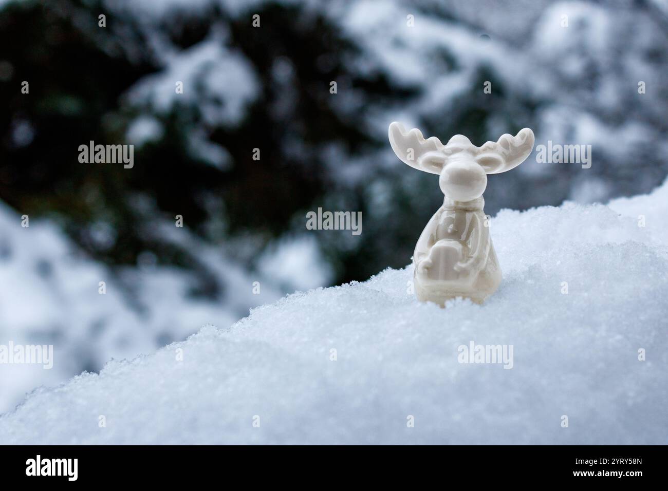 Snow-Covered Moose Figurine in a Winter Forest Landscape Stock Photo ...