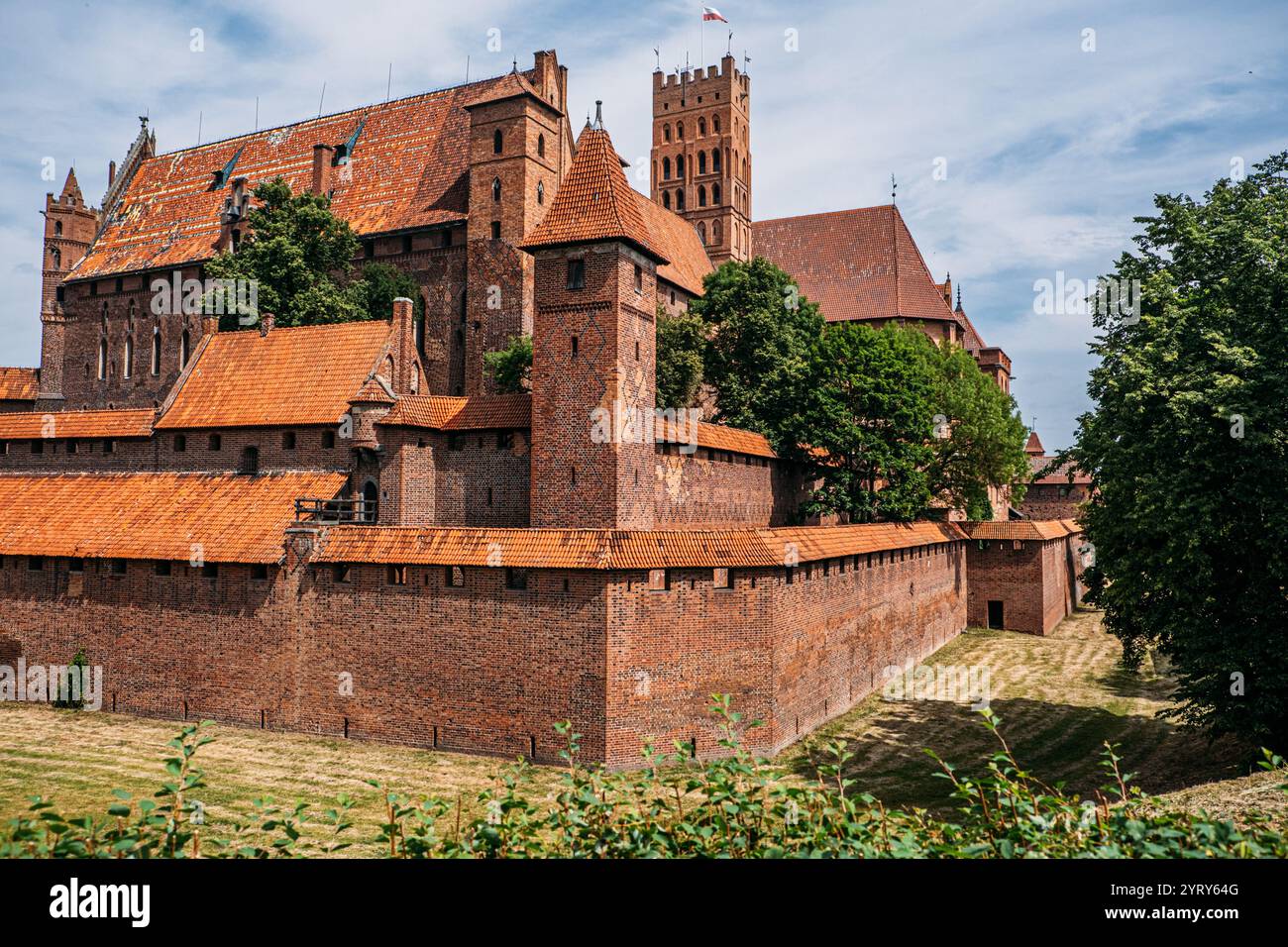 Close-up of Malbork Castle's red brick walls and rooftops showcasing ...