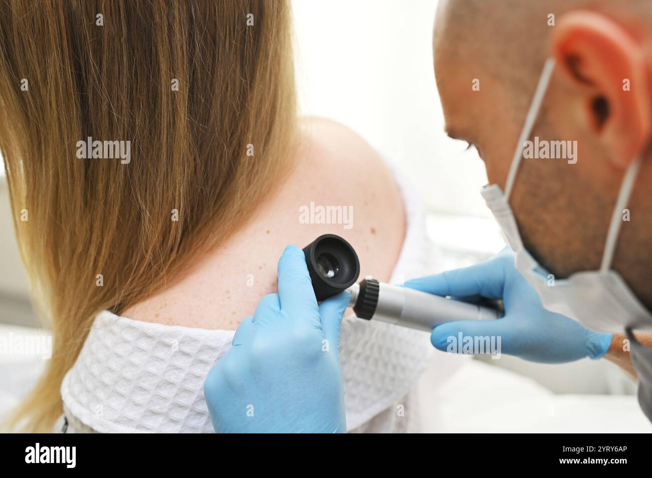 Dermatologist using magnifying glass hi-res stock photography and ...